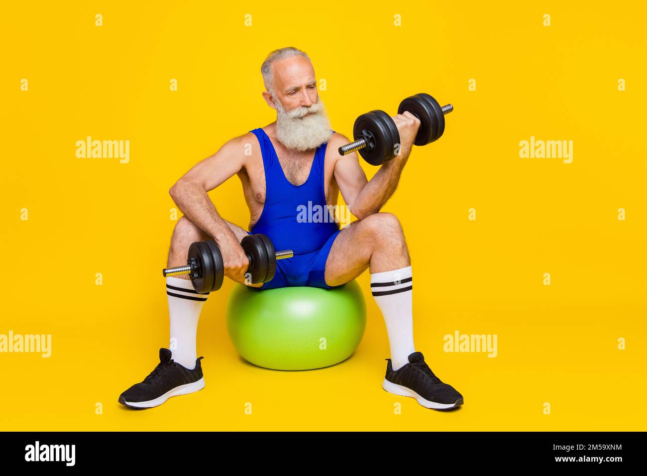 Full length photo of old senior grandfather gray beard hold hard weight ...