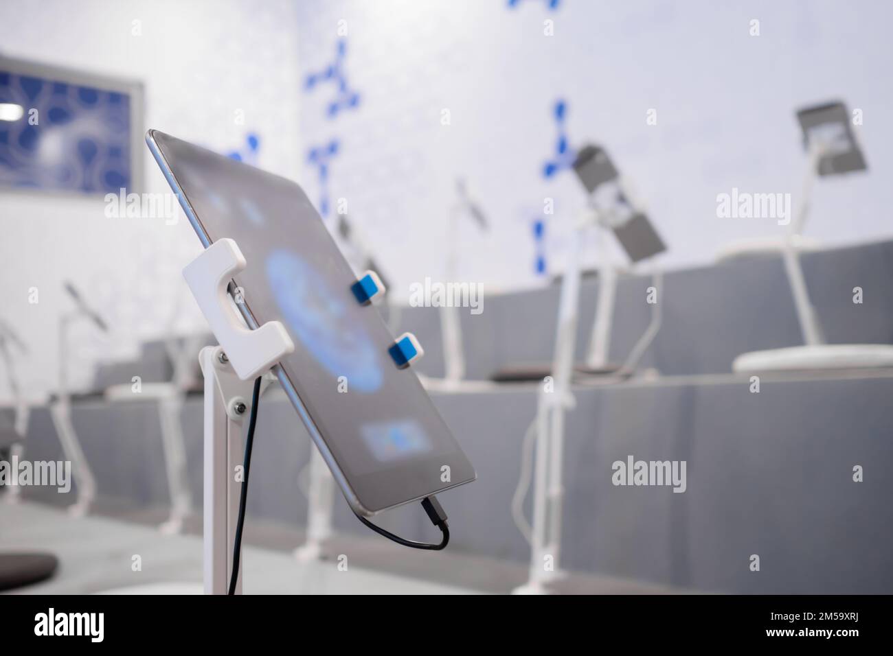 Many floor mount tablets at science exhibition, museum, auditorium or ...