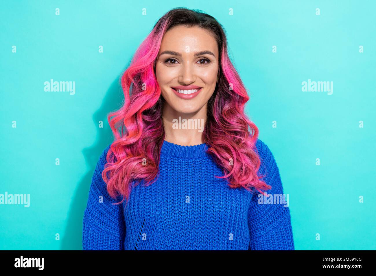 Portrait of optimistic pretty woman with wavy hairstyle wear knit ...