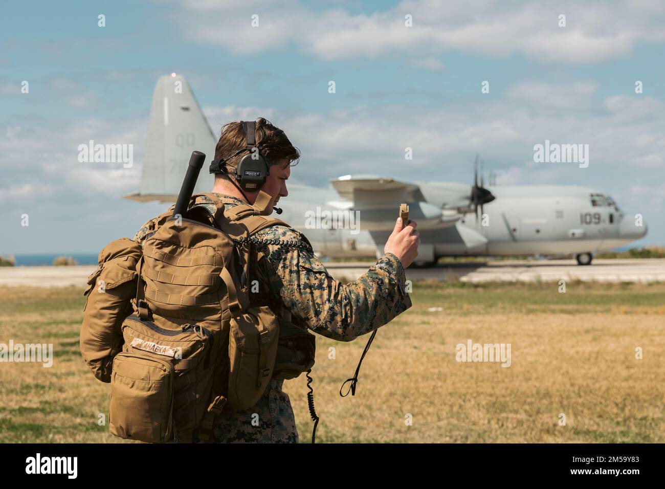 A U.S. Marine with Marine Air Control Squadron 4 controls a KC-130J ...