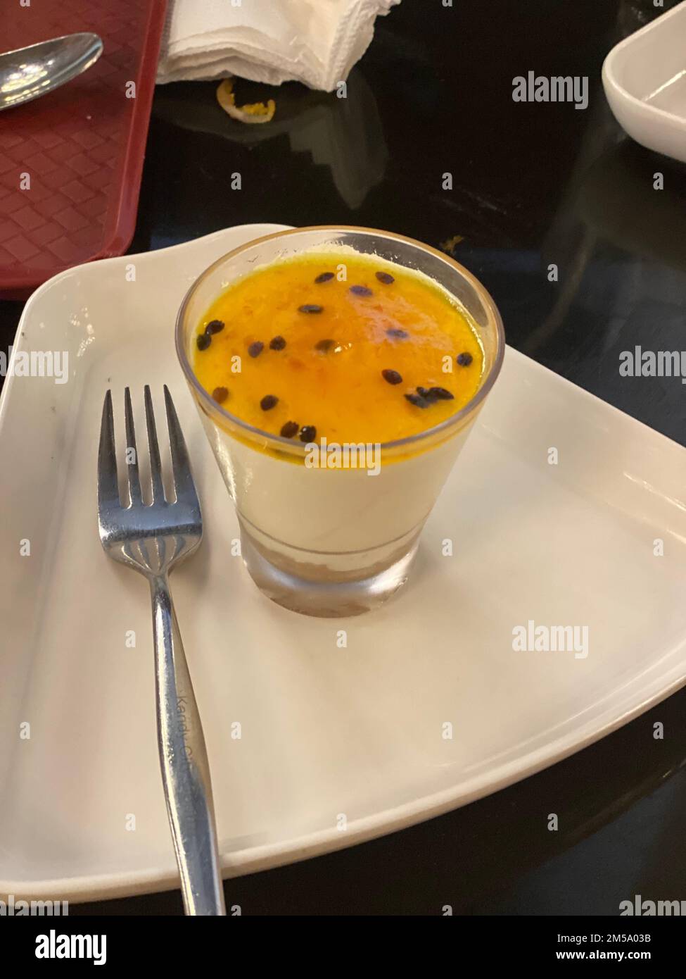 A vertical high-angle view of the granadilla fridge tart in a small ...