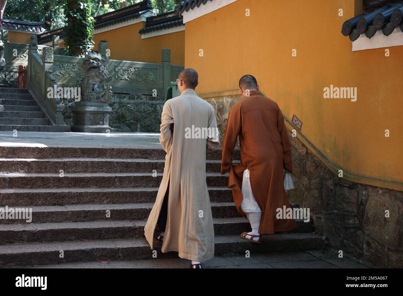 Monks walking back temple hi-res stock photography and images - Alamy