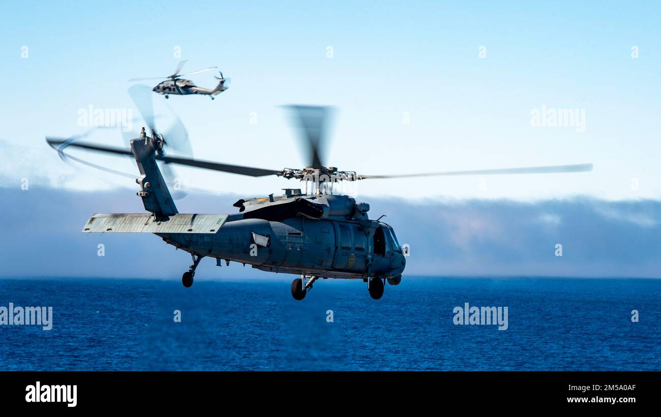 220213-N-MD461-1094 PACIFIC OCEAN (Feb. 13, 2022) Two MH-60S Sea Hawks ...