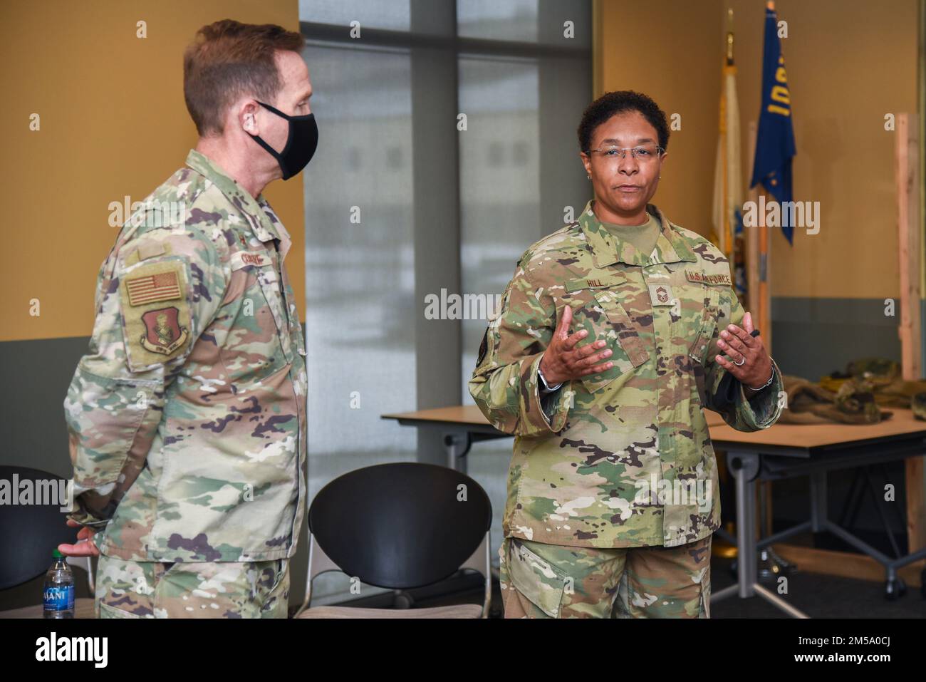 Chief Master Sgt. Tori Hill, right, gives opening remarks next to Col ...