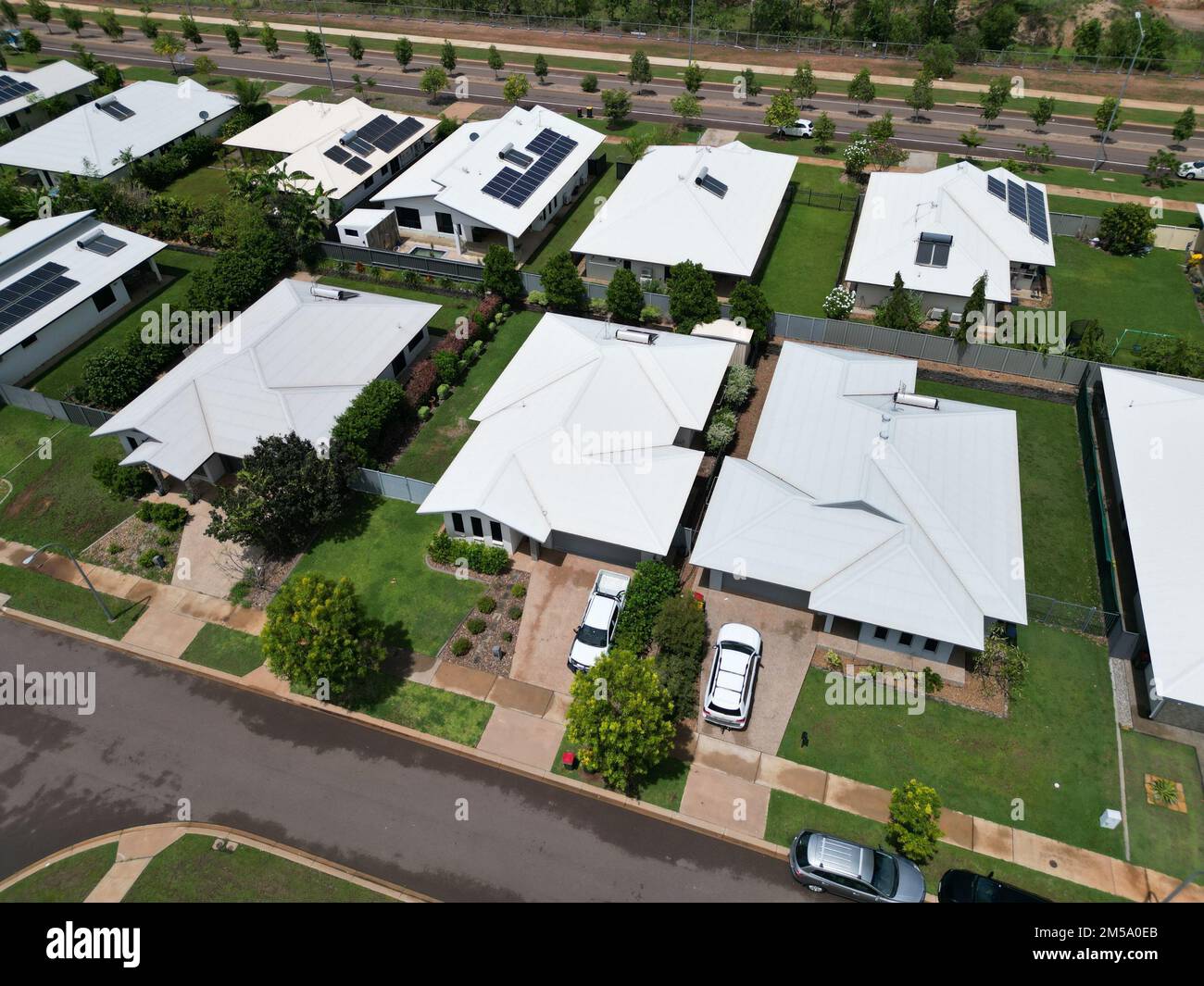 an Aerial View of a residential area with streets and houses with white ...
