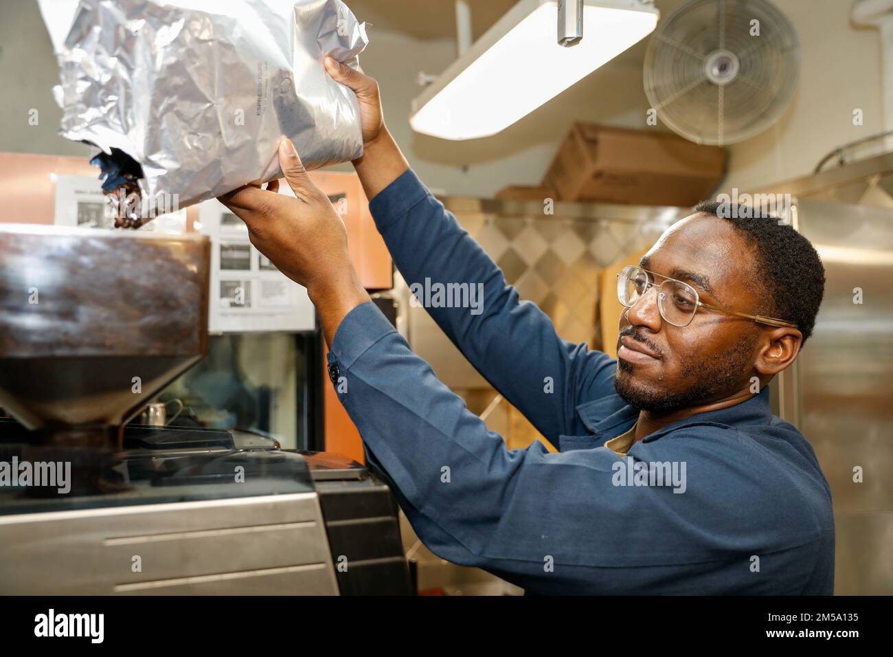 PHILIPPINE SEA (Feb. 13, 2022) Retail Specialist Seaman Apprentice Troy ...