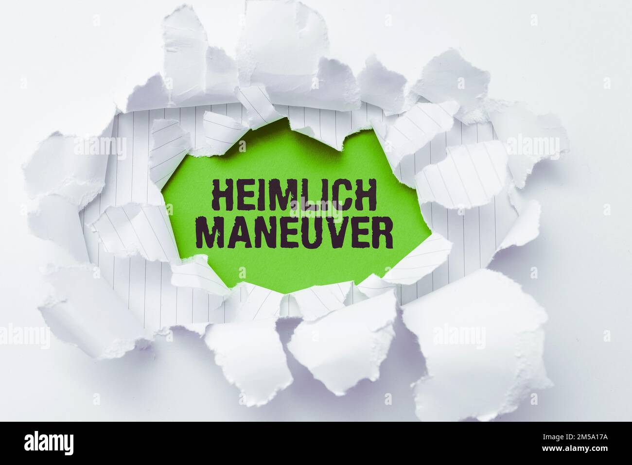 Sign displaying Heimlich Maneuver. Word Written on application of ...
