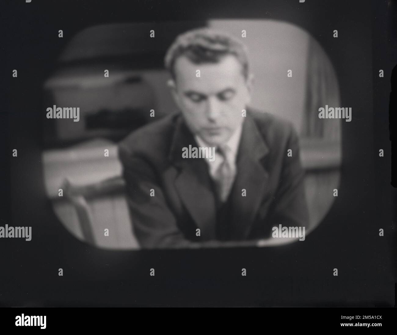 1958, historical, image on a television screen of Kenneth Kendall, BBC ...