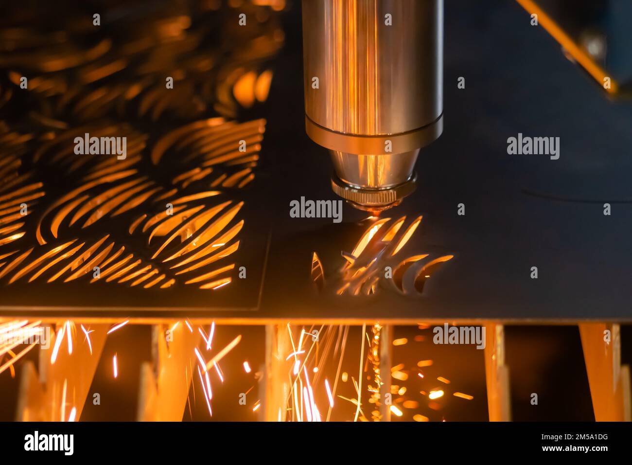 Industrial laser cutter sparks close hi-res stock photography and ...