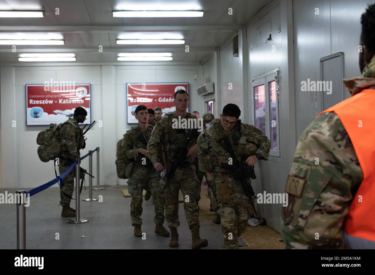 U.S. Army soldiers assigned to the 82nd Airborne Division walk towards ...
