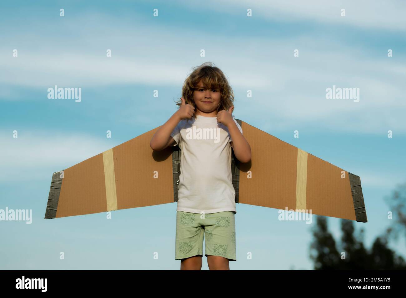 Child boy toddler playing with toy airplane and dreaming future. Happy ...