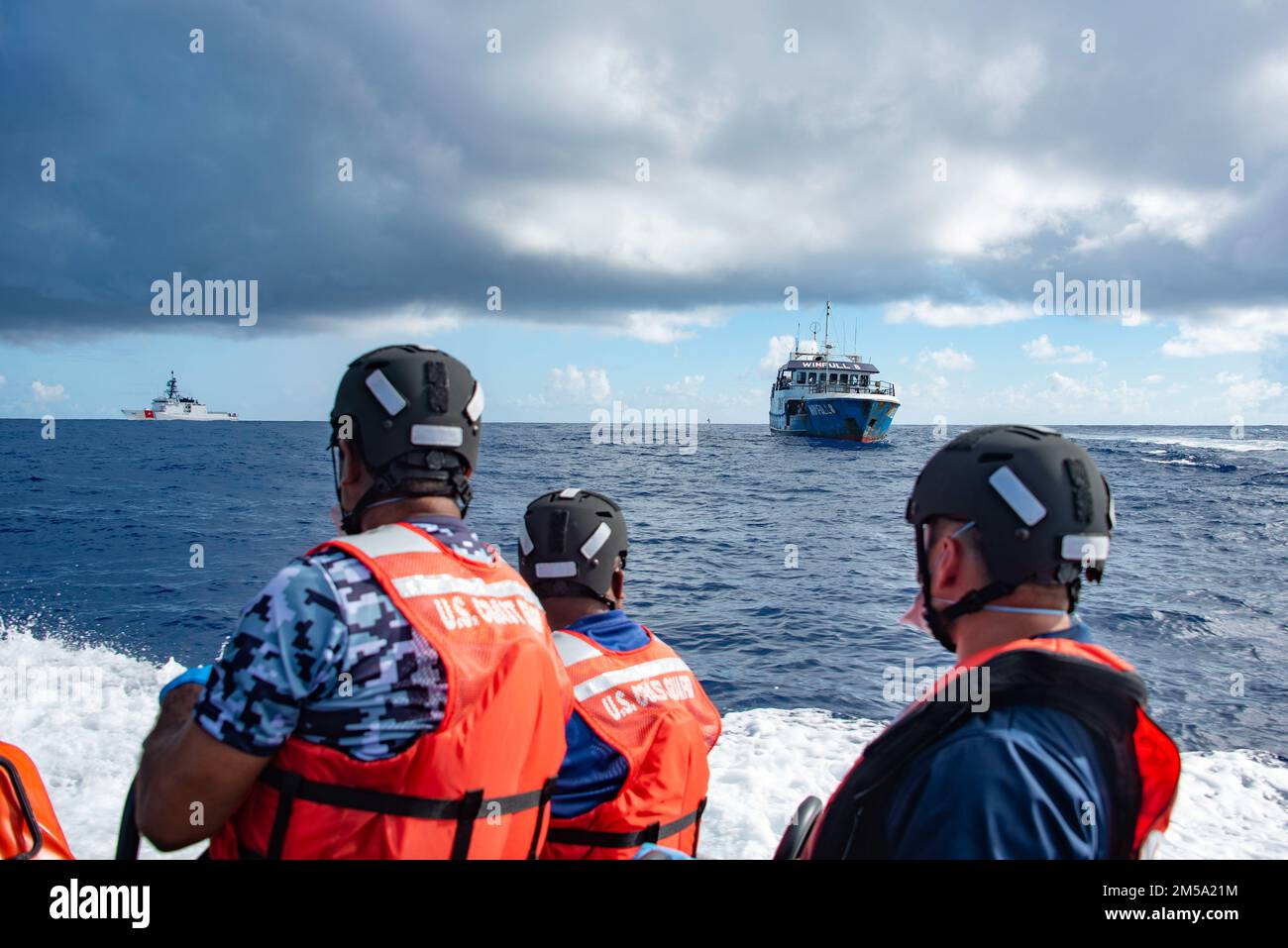 U.S. Coast Guard members assigned to the USCGC Stratton (WMSL 752) and ...