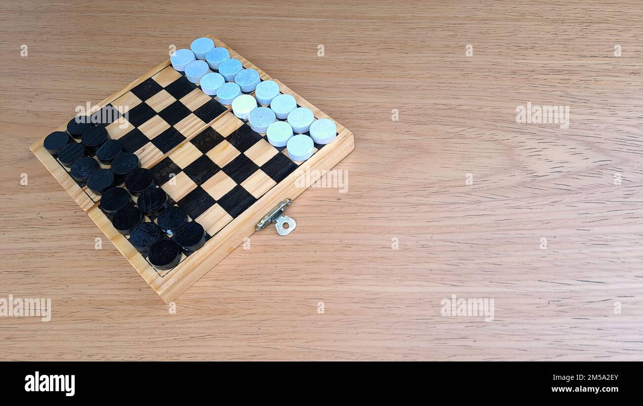 Checkerboard with checkers - Business strategy planning. Plastic ...