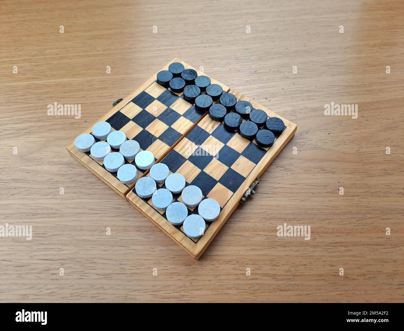 Checkerboard with checkers - Business strategy planning. Plastic ...