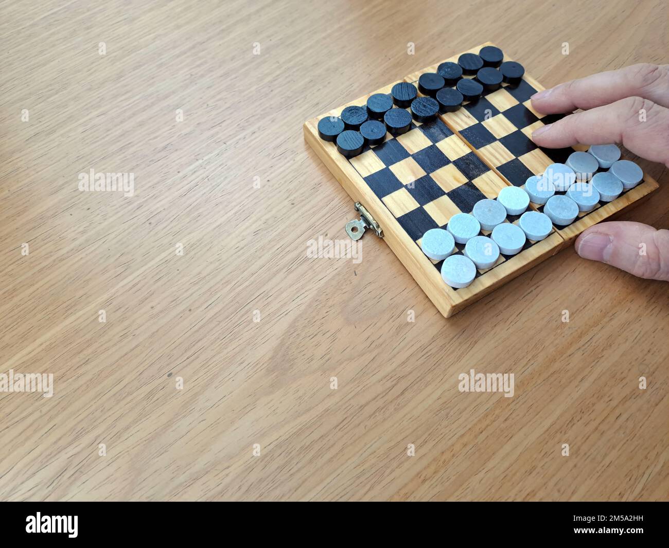 Checkerboard with checkers - Business strategy planning. Plastic ...