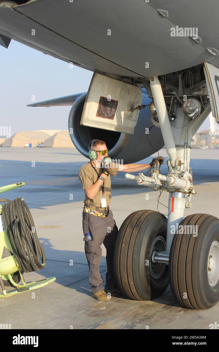 U.S. Air Force crew chief Senior Airman Cameron Stoker communicates ...
