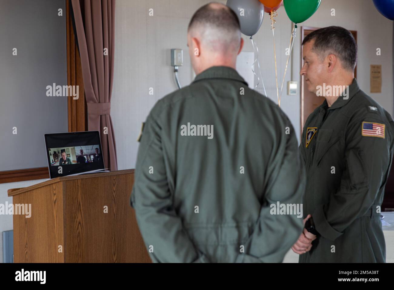 U.S. Navy Capt. Adrian Calder, left, the offgoing commanding officer of ...