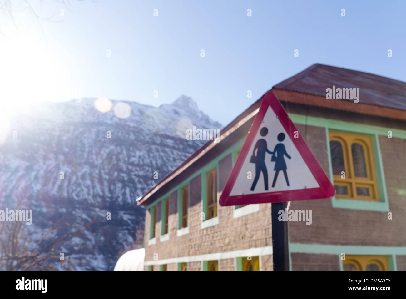 Road sign warning against slippery road due to snow ice Stock Photo - Alamy