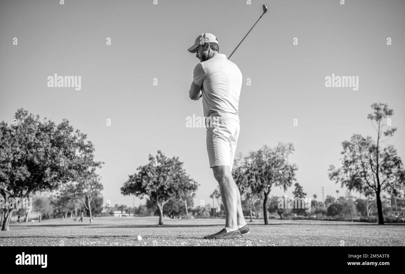 male golf player on professional golf course. portrait of golfer in cap ...