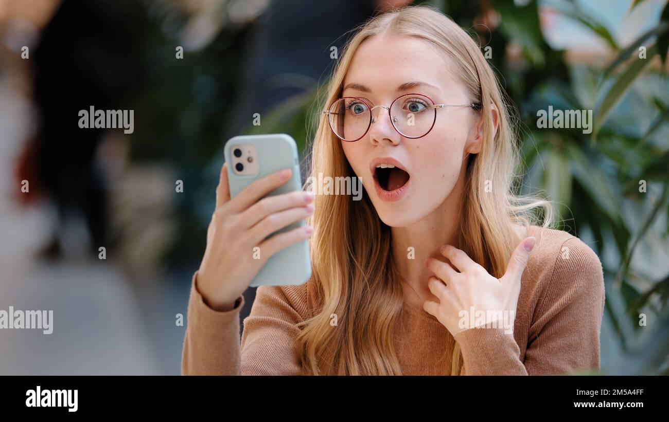 Portrait caucasian girl blonde successful lucky woman in glasses looks ...