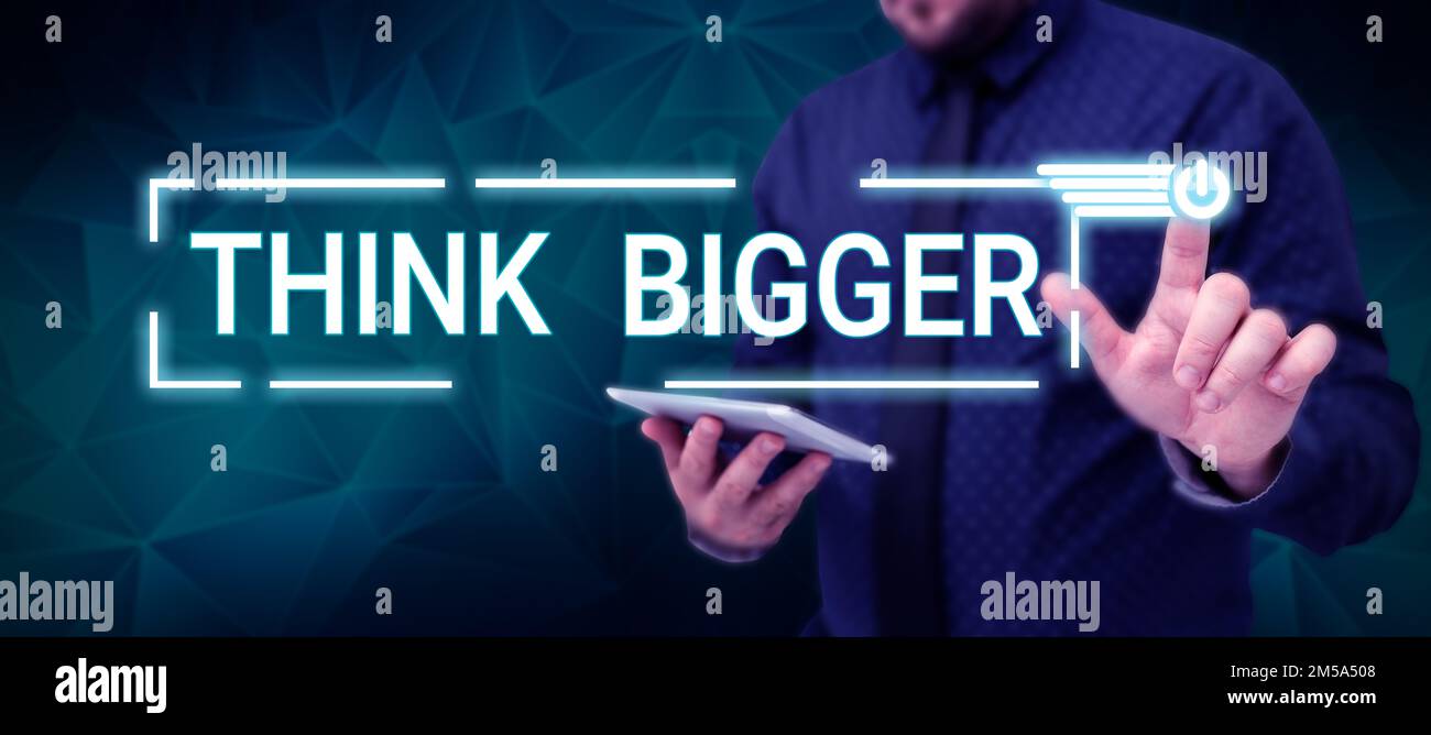 Hand writing sign Think Bigger. Business approach being able to dream ...