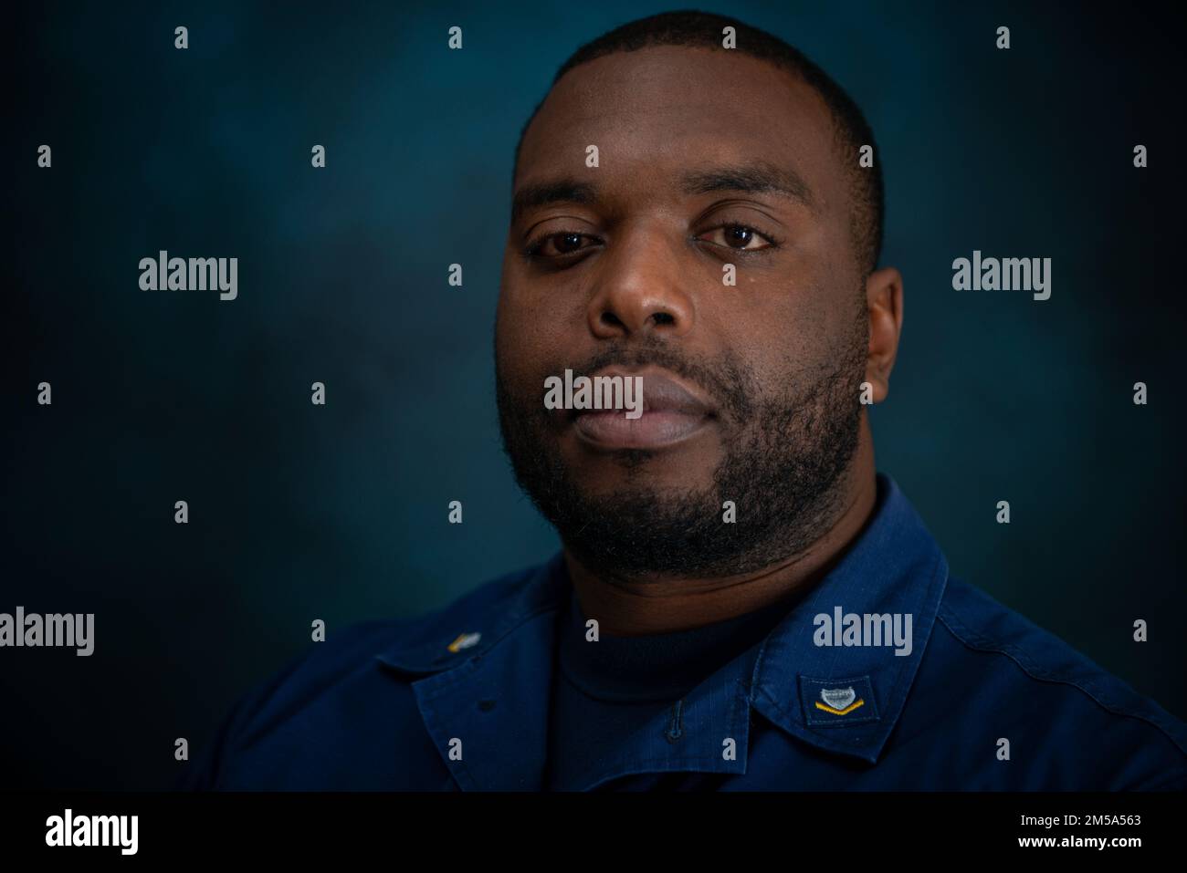 Petty Officer 3rd Class Deangelo Friends, a yeoman assigned to Coast ...