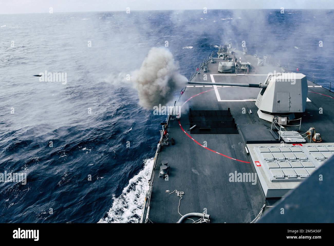 The guided-missile destroyer USS Momsen (DDG 92) conducts a gun ...