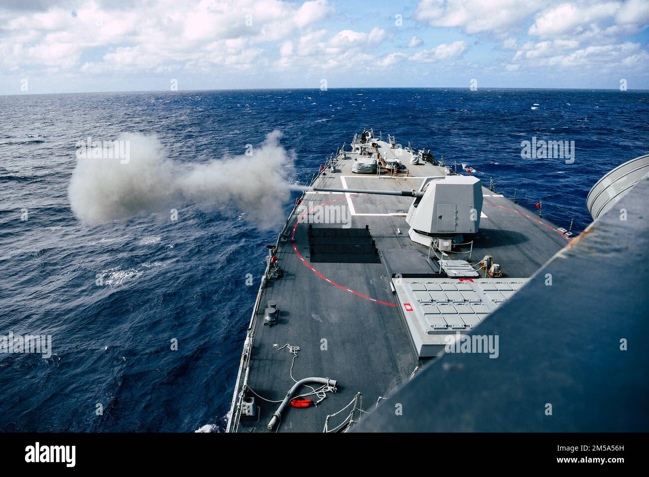 The guided-missile destroyer USS Momsen (DDG 92) conducts a gun ...