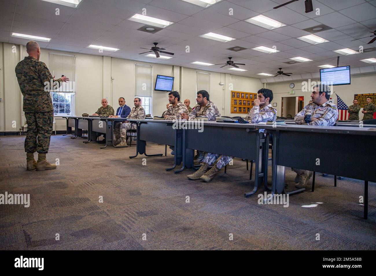 Officers with the Qatar Armed Forces (QAF) receive a brief at Marine ...
