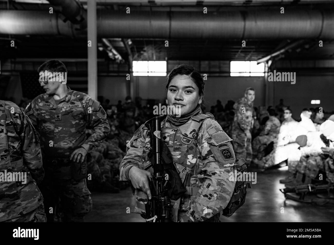 A U.S. Army Paratrooper assigned to the 82nd Airborne Division prepares ...