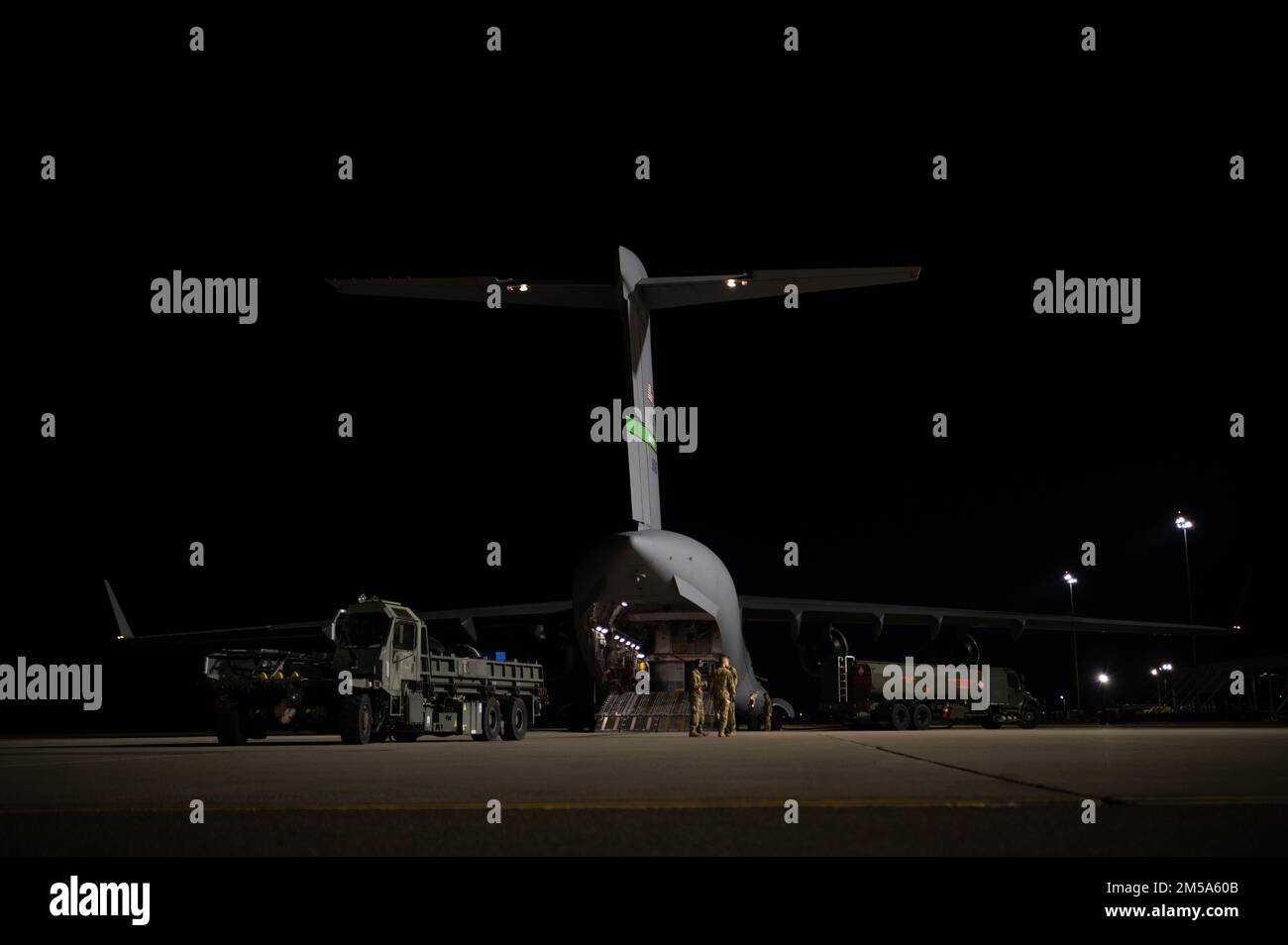 U.S. Airmen prepare to load a K-loader onto a C-17 Globemaster III at ...