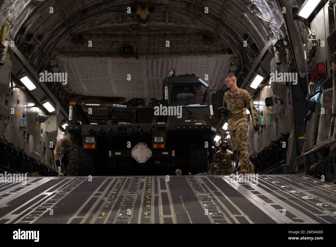 U.S. Air Force Airman 1st Class Chase Smith, right, 8th Airlift ...