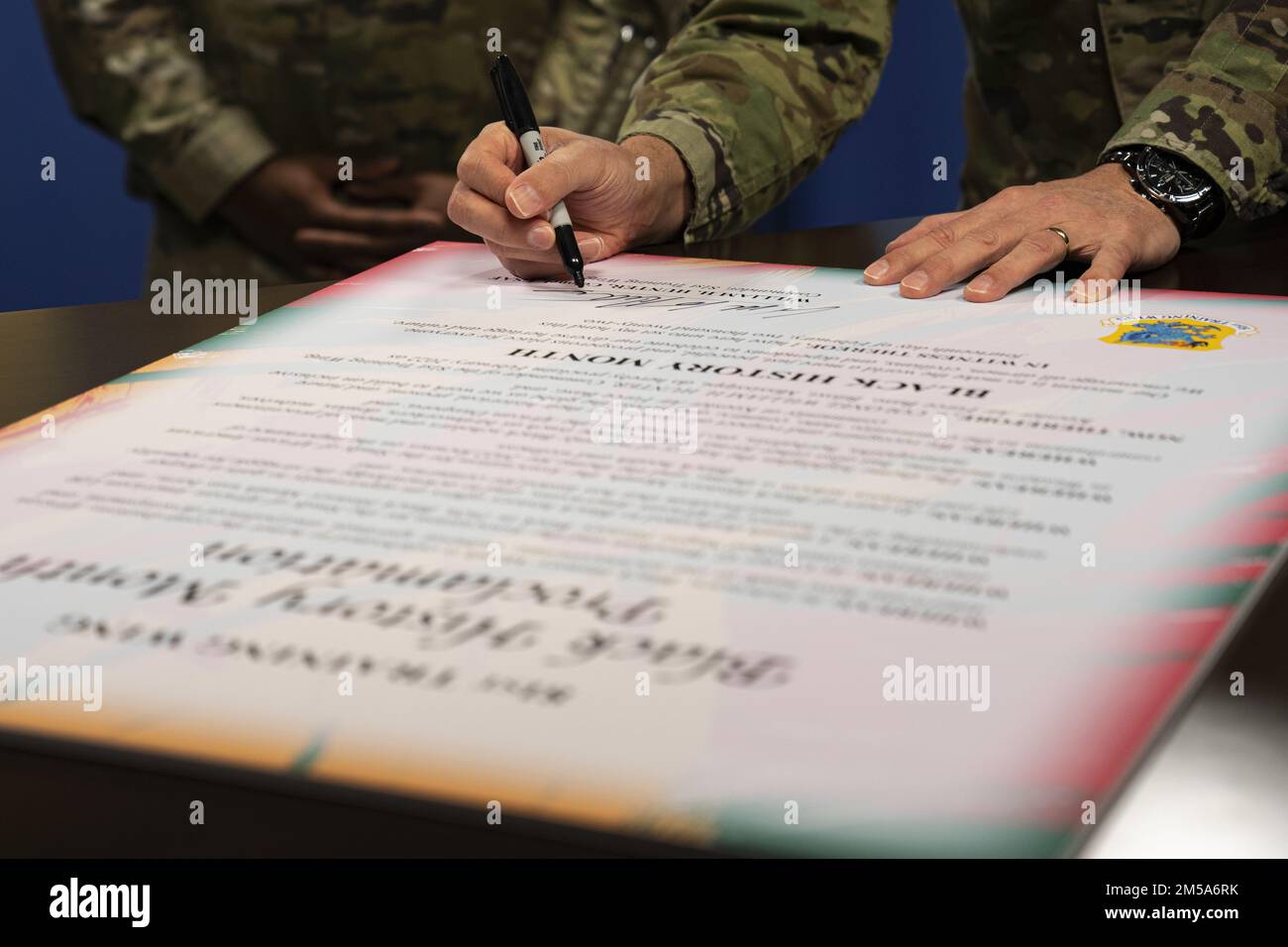 U.S. Air Force Col. William Hunter, 81st Training Wing commander, signs ...