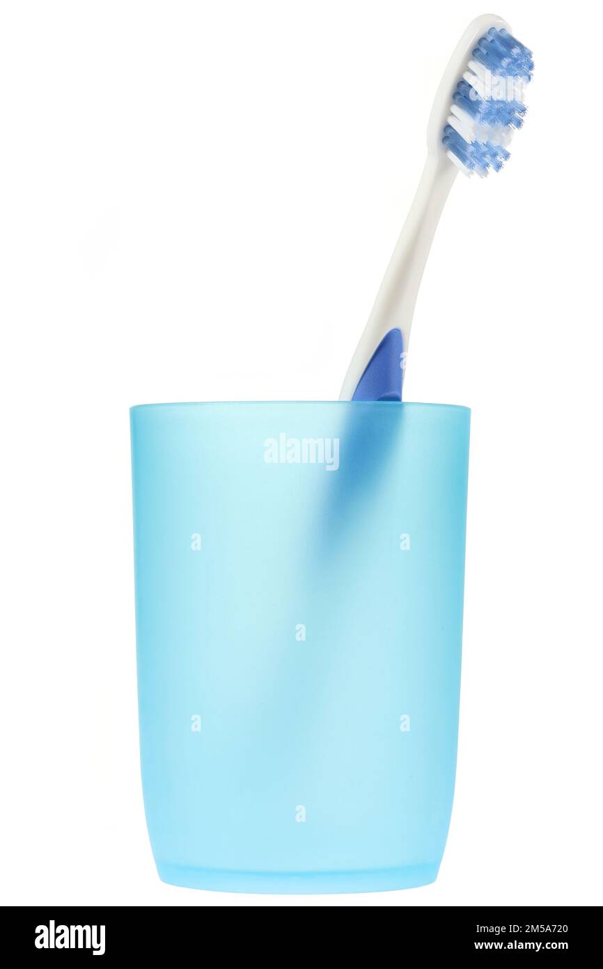 toothbrush in tooth mug isolated on white background Stock Photo - Alamy