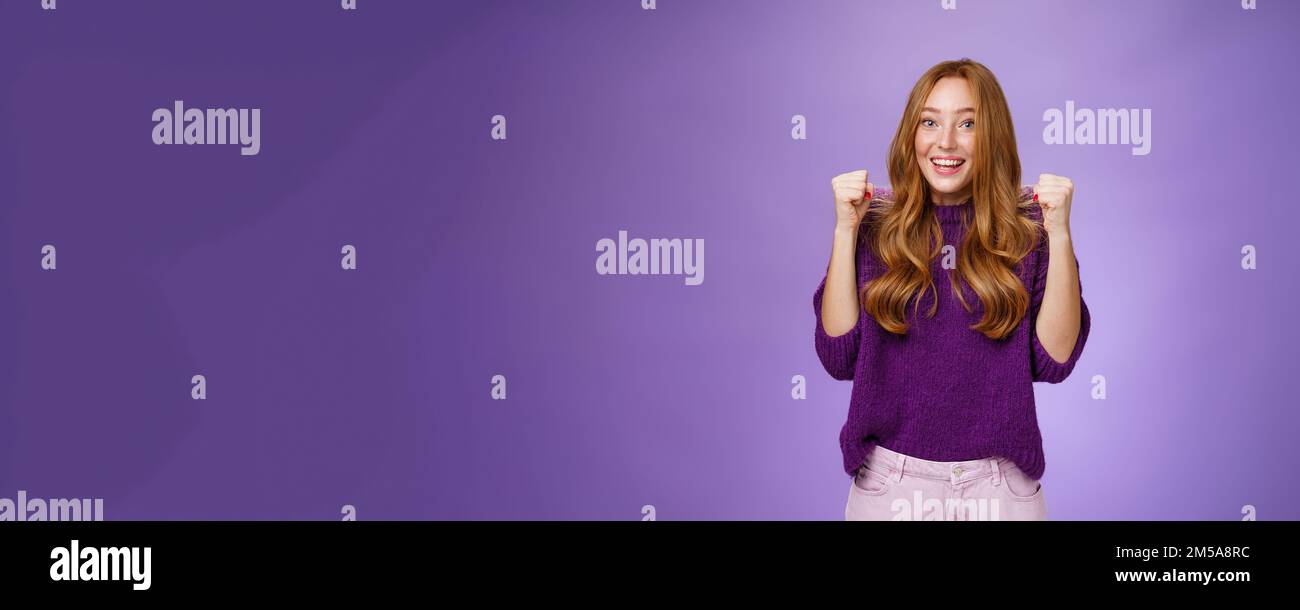 Yey we made it. Happy and cheerful young pretty redhead 20s girl in ...