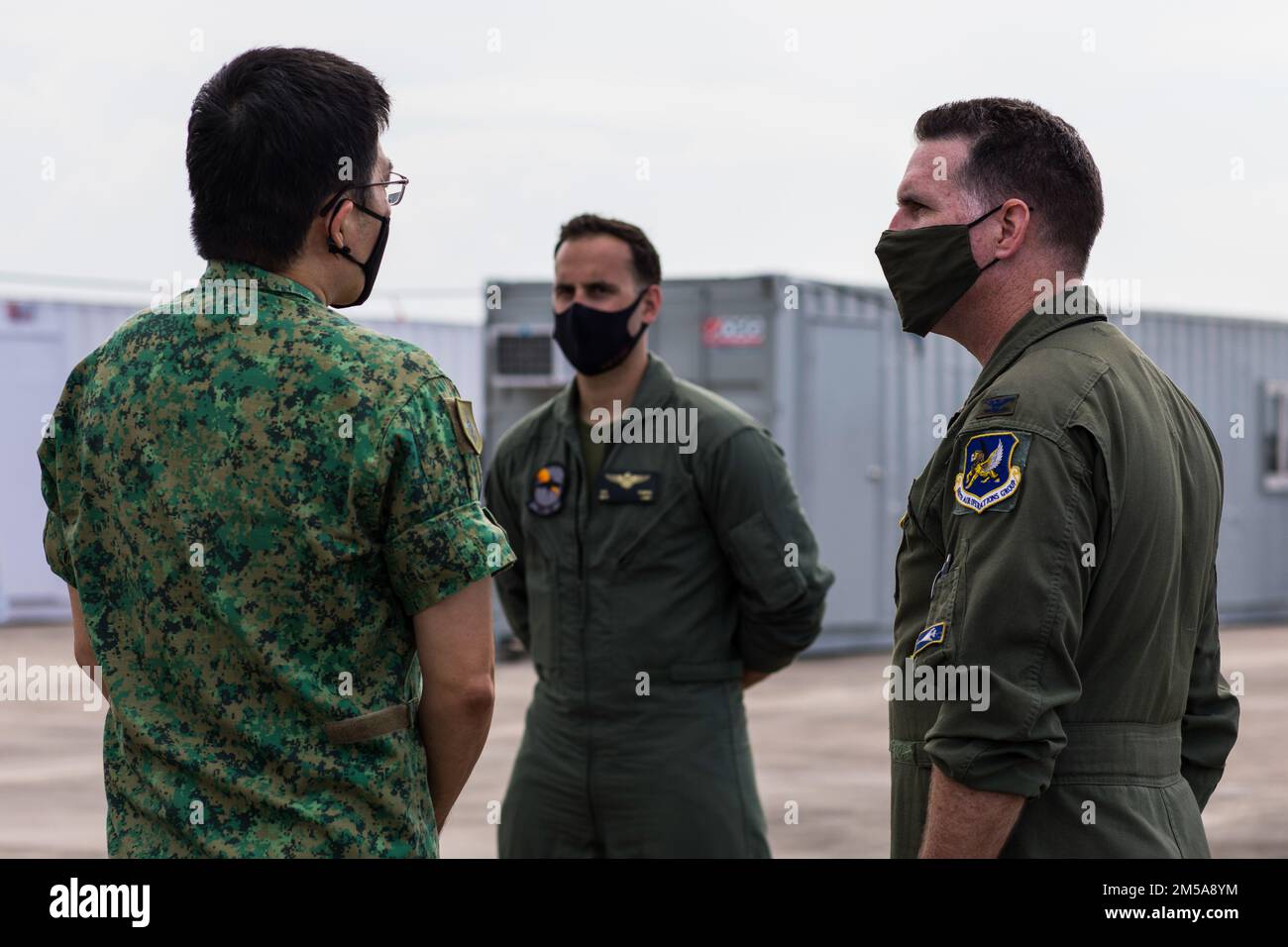 U.S. Air Force Col. Brian McClanahan speaks with Lt. Gen. Melvyn Ong ...