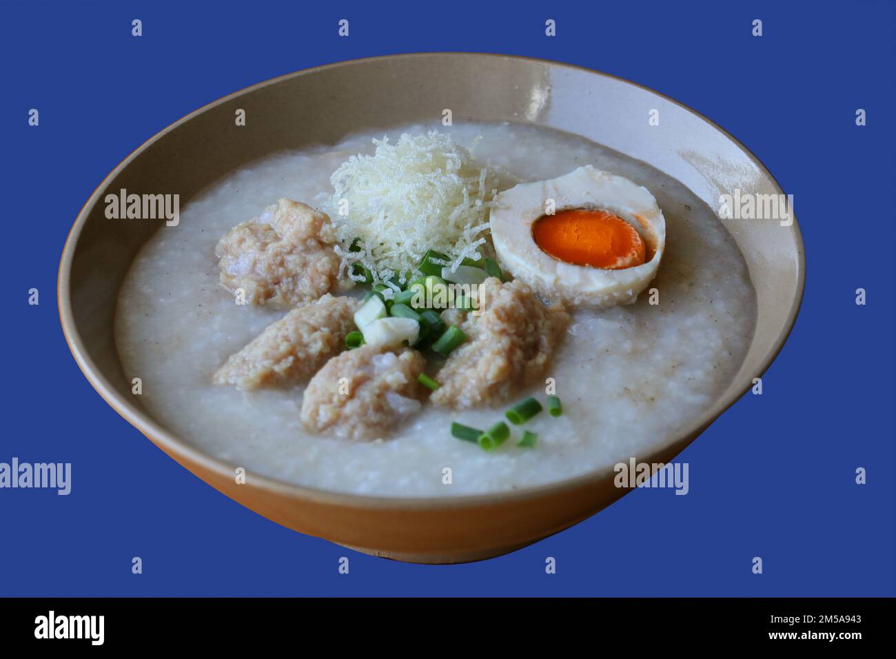 Isolated Congee with salted egg and meatball Stock Photo - Alamy