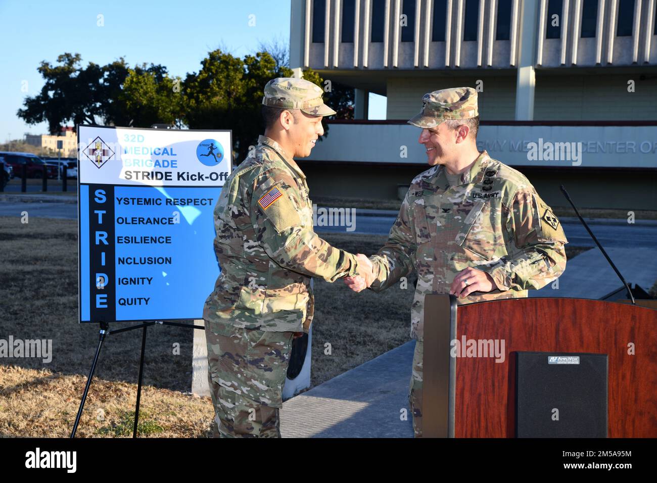 Army Col. Marc Welde, 32d Medical Brigade Commander, right, invites Spc ...