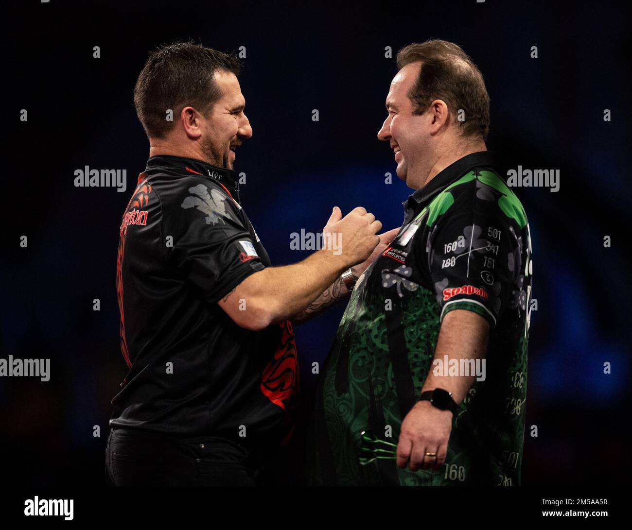Jonny Clayton console Brendan Dolan after winning their match during ...