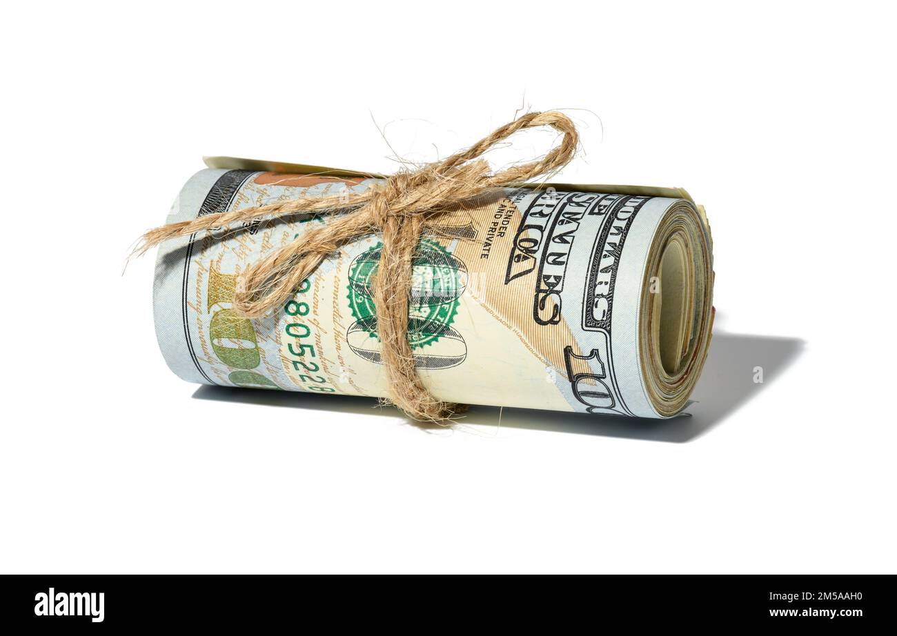 Rope tied roll of one hundred dollar bills isolated on white background ...