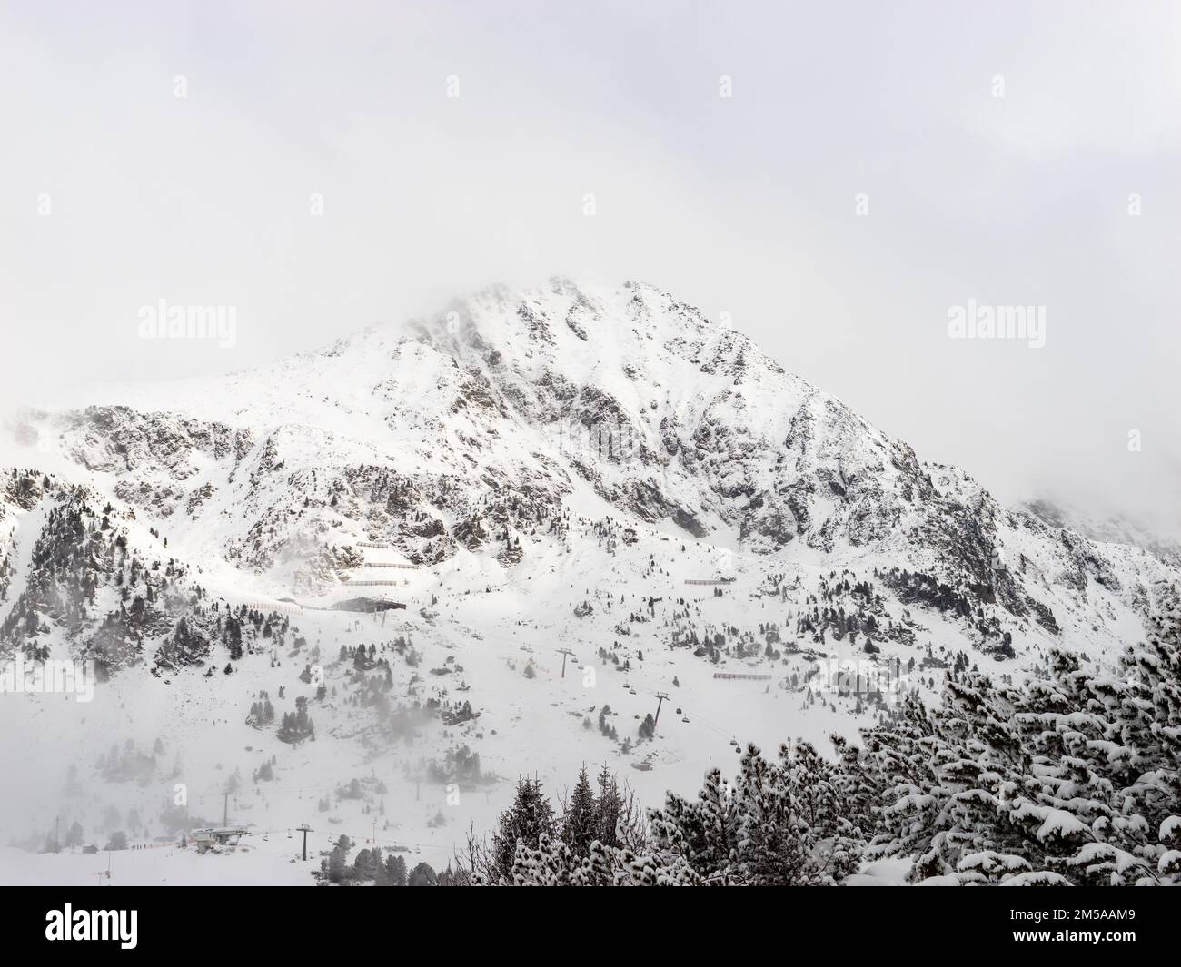 Mountain peak in the European Alps during winter. The Rocks are covered ...