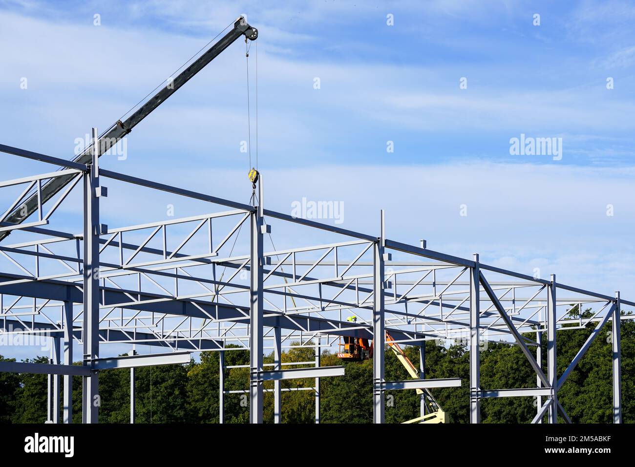 New building steel framework assembly using telescopic boom crane and ...