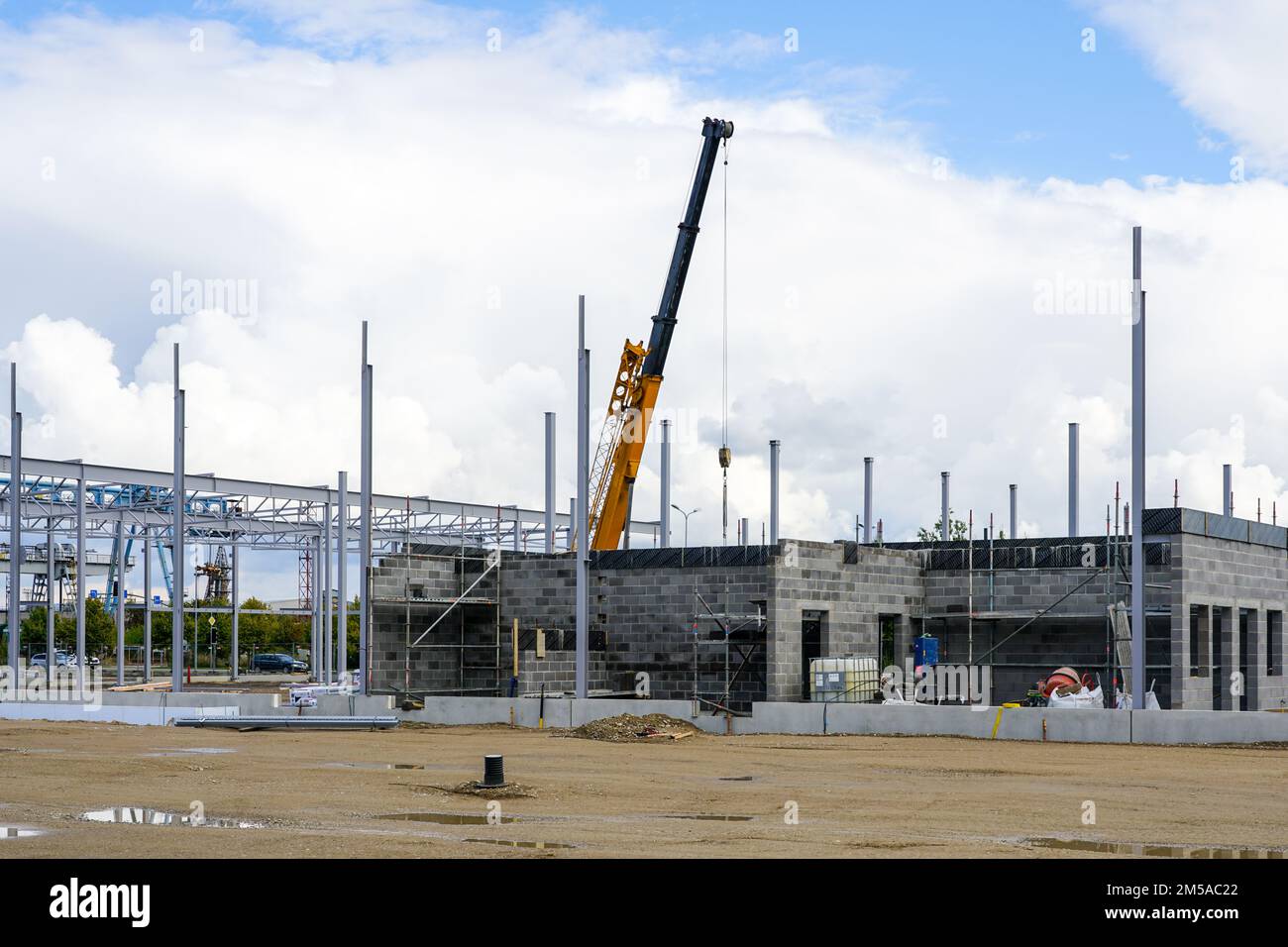 Telescopic boom crane on construction site of a new modern steel ...
