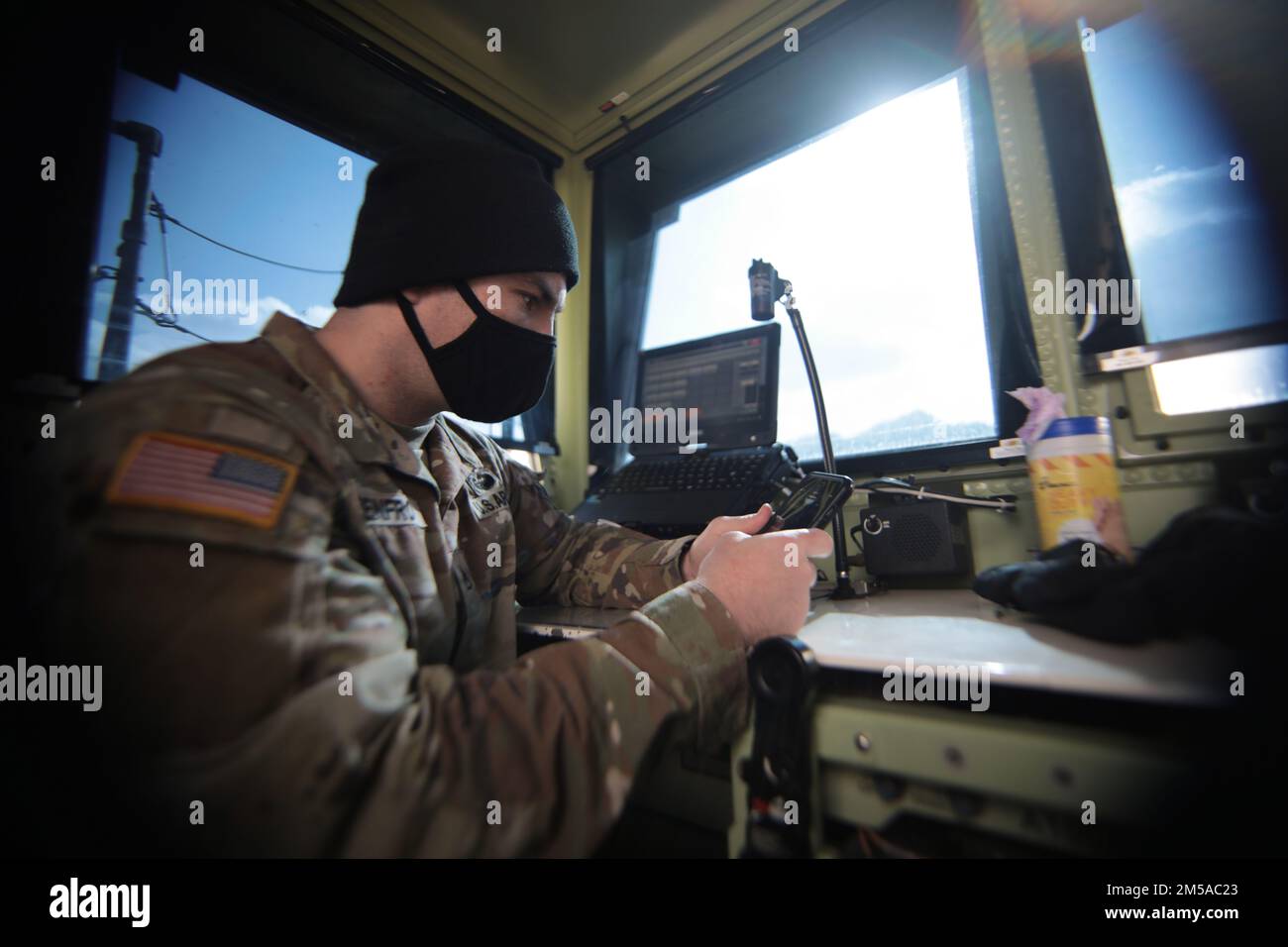 Staff Sgt. John T. Renfro, exchanges information with the Tactical ...