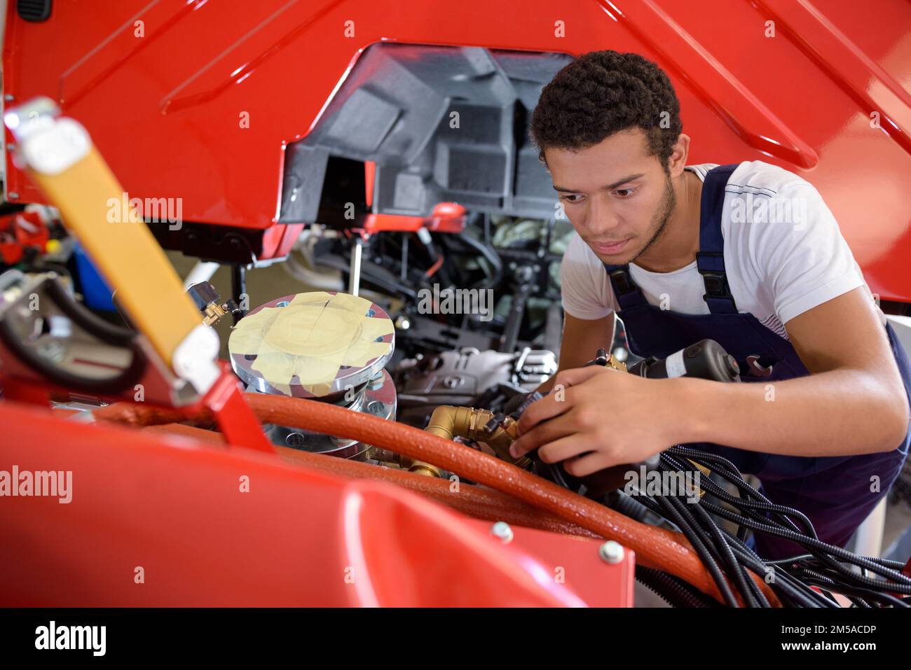 man fixing a truck engine Stock Photo - Alamy