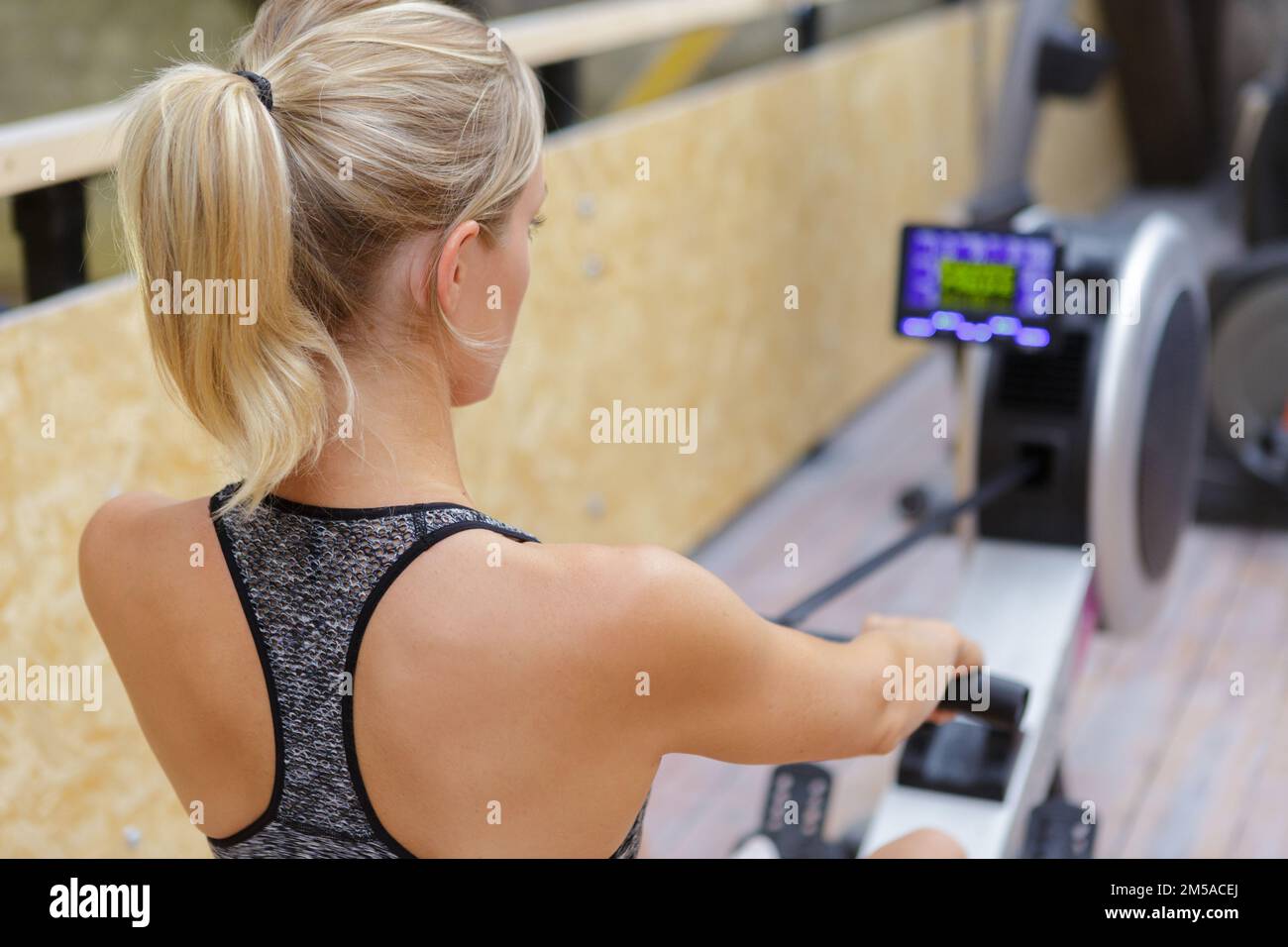 Woman practicing rowing exercise hi-res stock photography and images ...