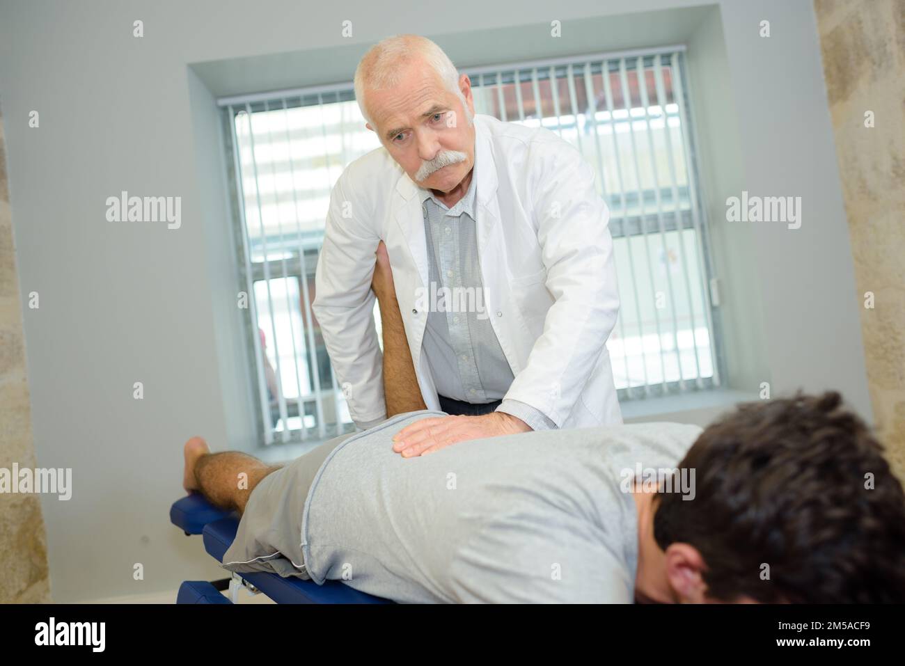 Young leg touching young mans hi-res stock photography and images - Alamy