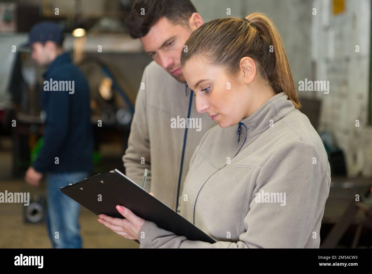 warehouse workers checking labels on shelves with goods Stock Photo - Alamy