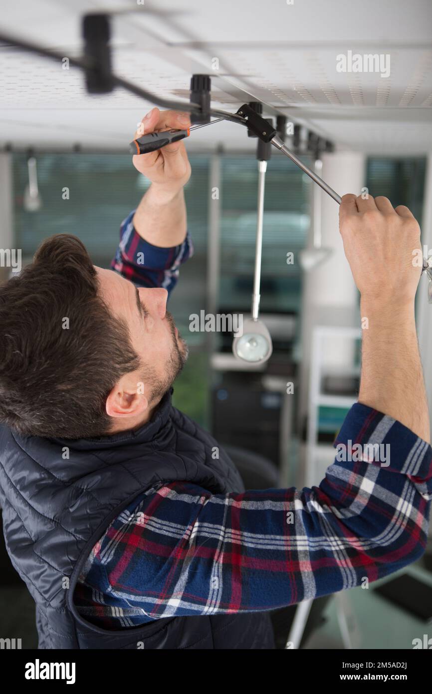 Man installing lights hi-res stock photography and images - Alamy