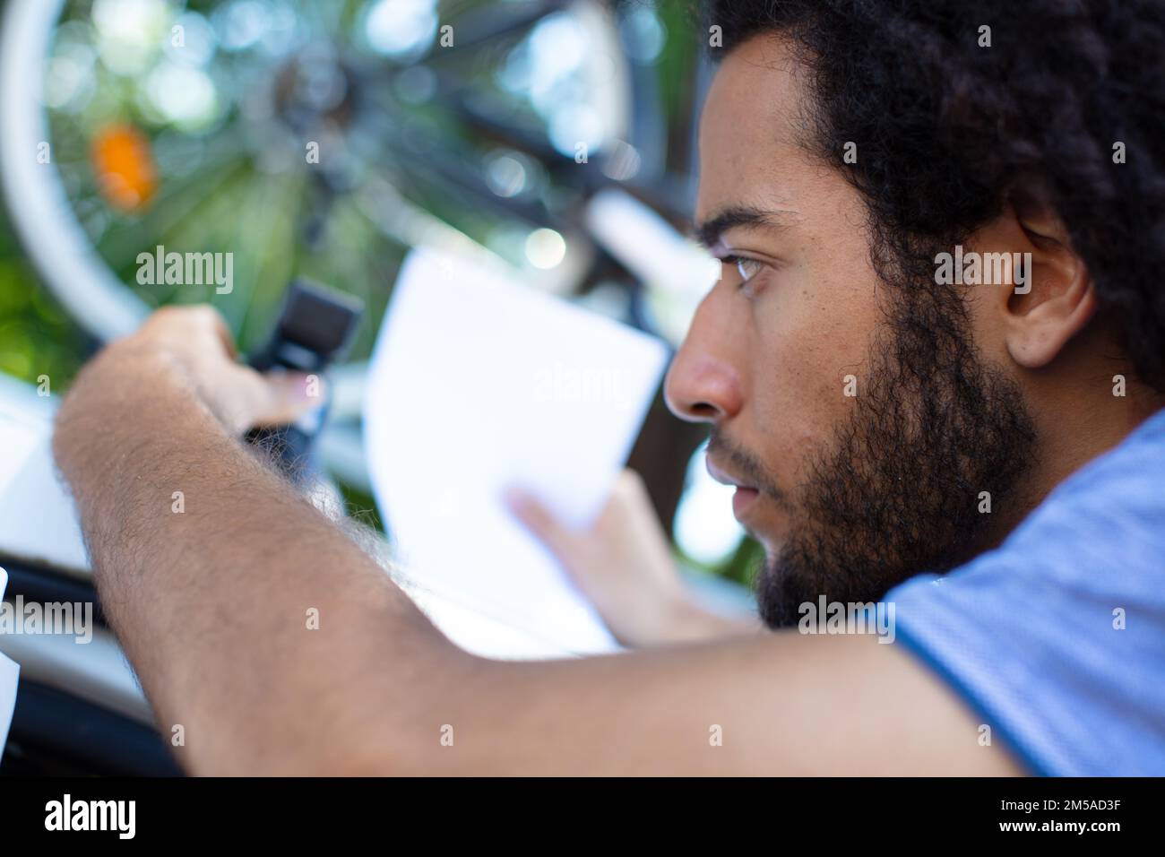 man loading bicycles on the bike rack Stock Photo - Alamy